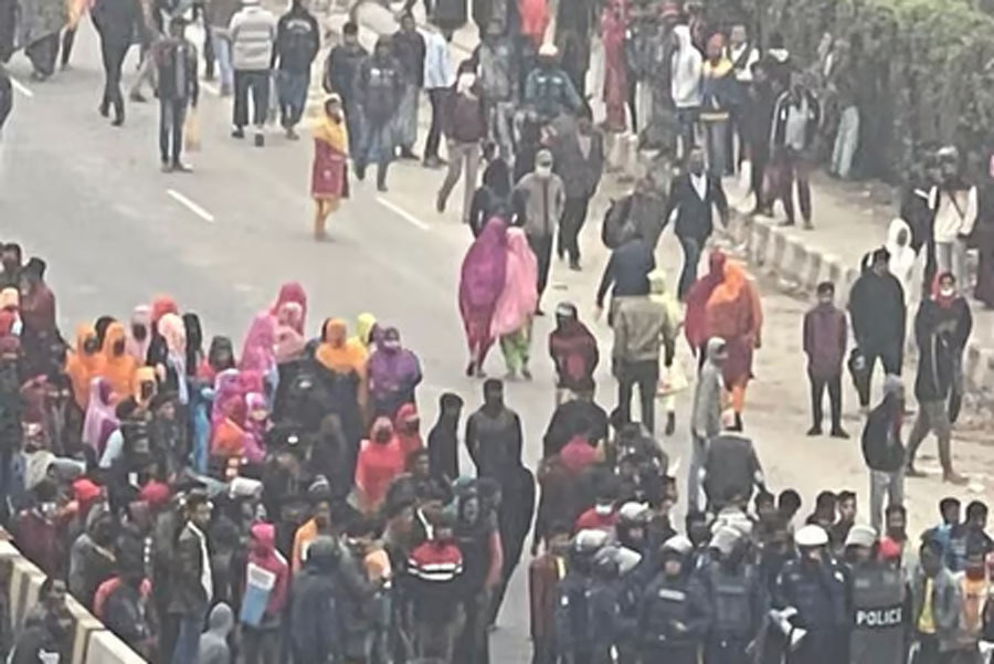 Factory workers protest on Dhaka-Tangail highway over new govt pay ...