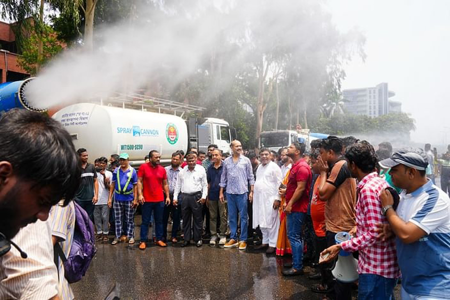 DNCC launches water sprinkling programme on chief heat officer’s ...